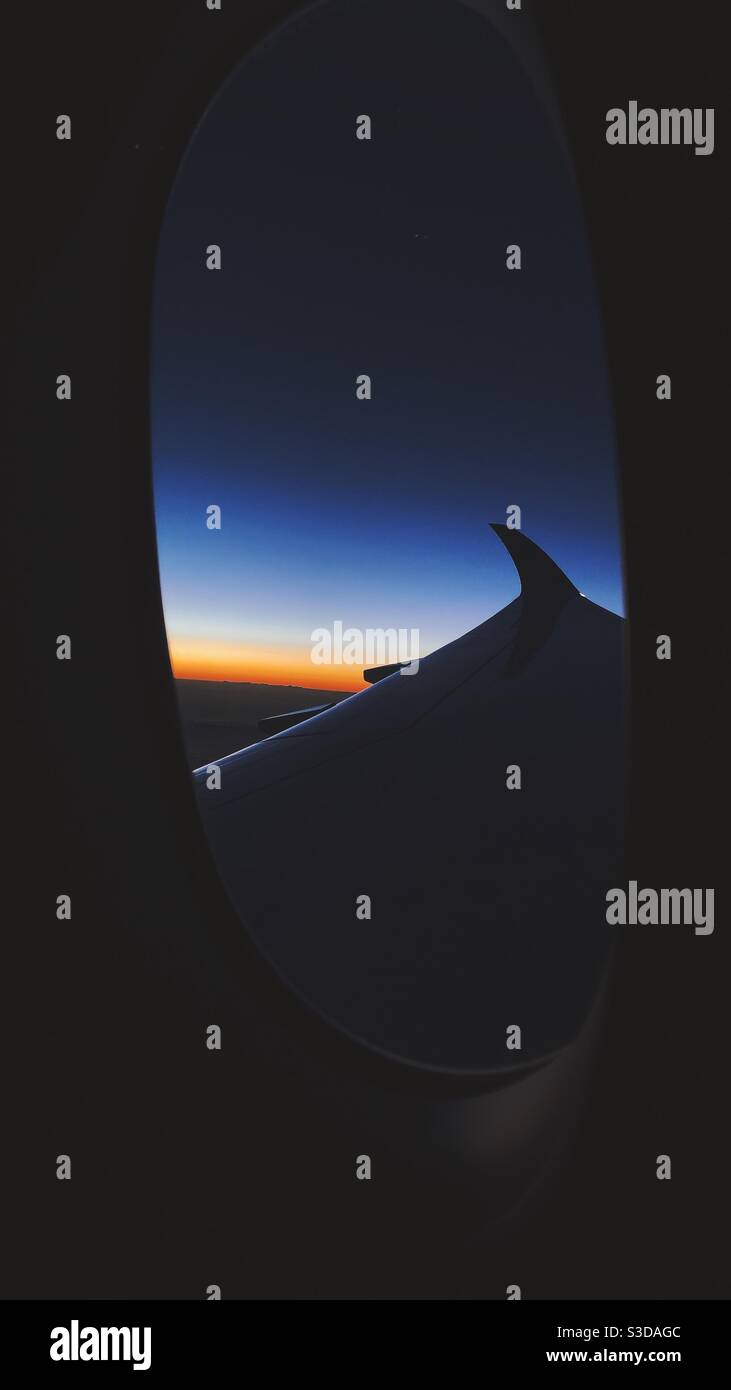 sunrise from an airplane window Stock Photo - Alamy