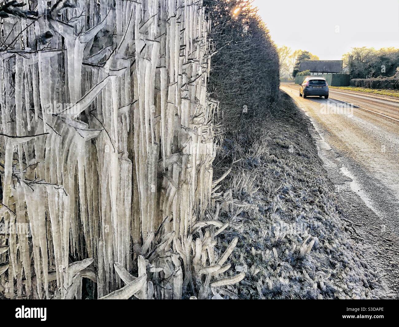 Frozen water splash caused by passing cars Stock Photo - Alamy