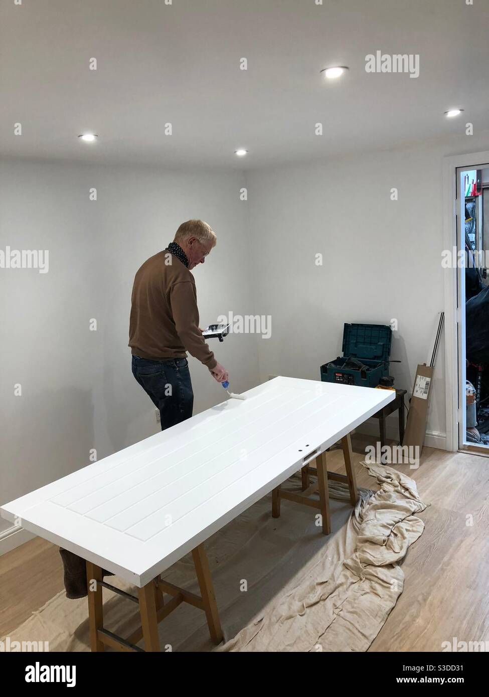 Older man painting door hi-res stock photography and images - Alamy