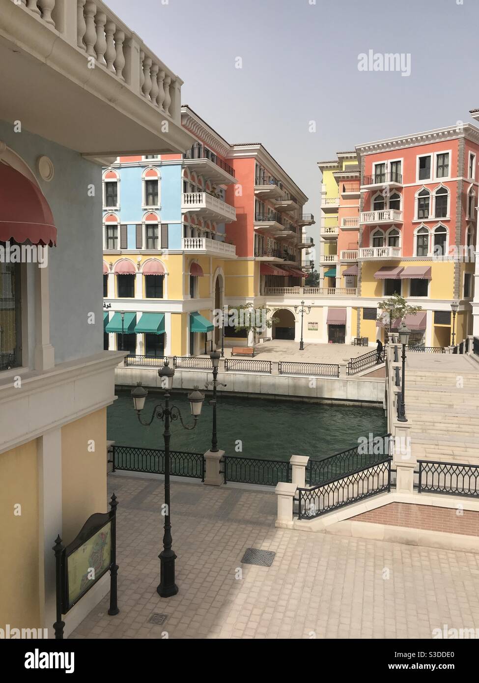 The beautiful coloured buildings of Qanat Quartier on the artificial ...