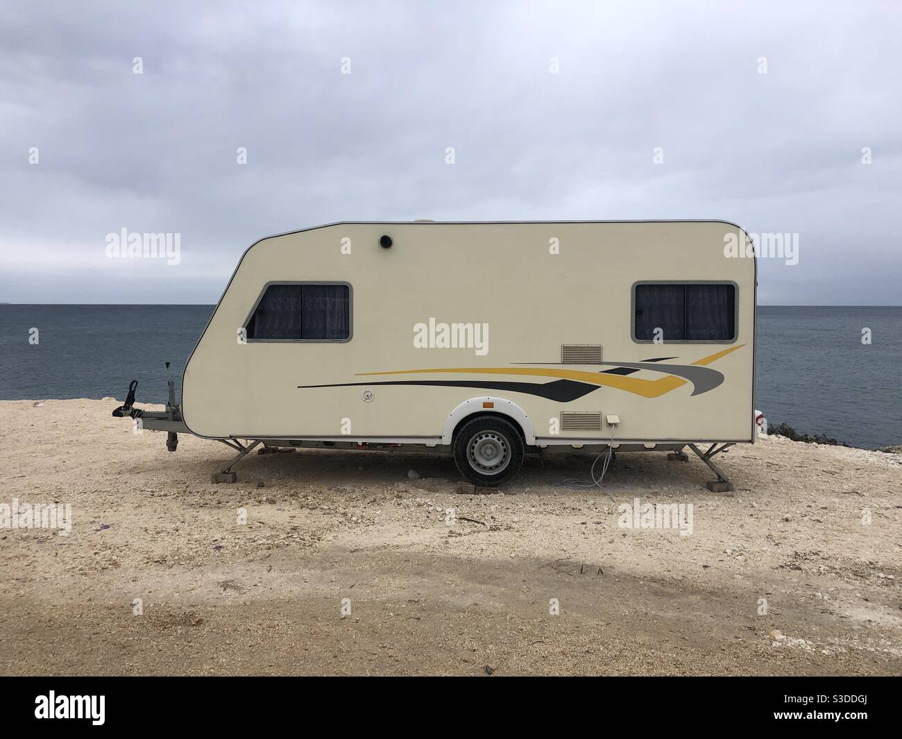 Caravan parked by the sea Stock Photo - Alamy