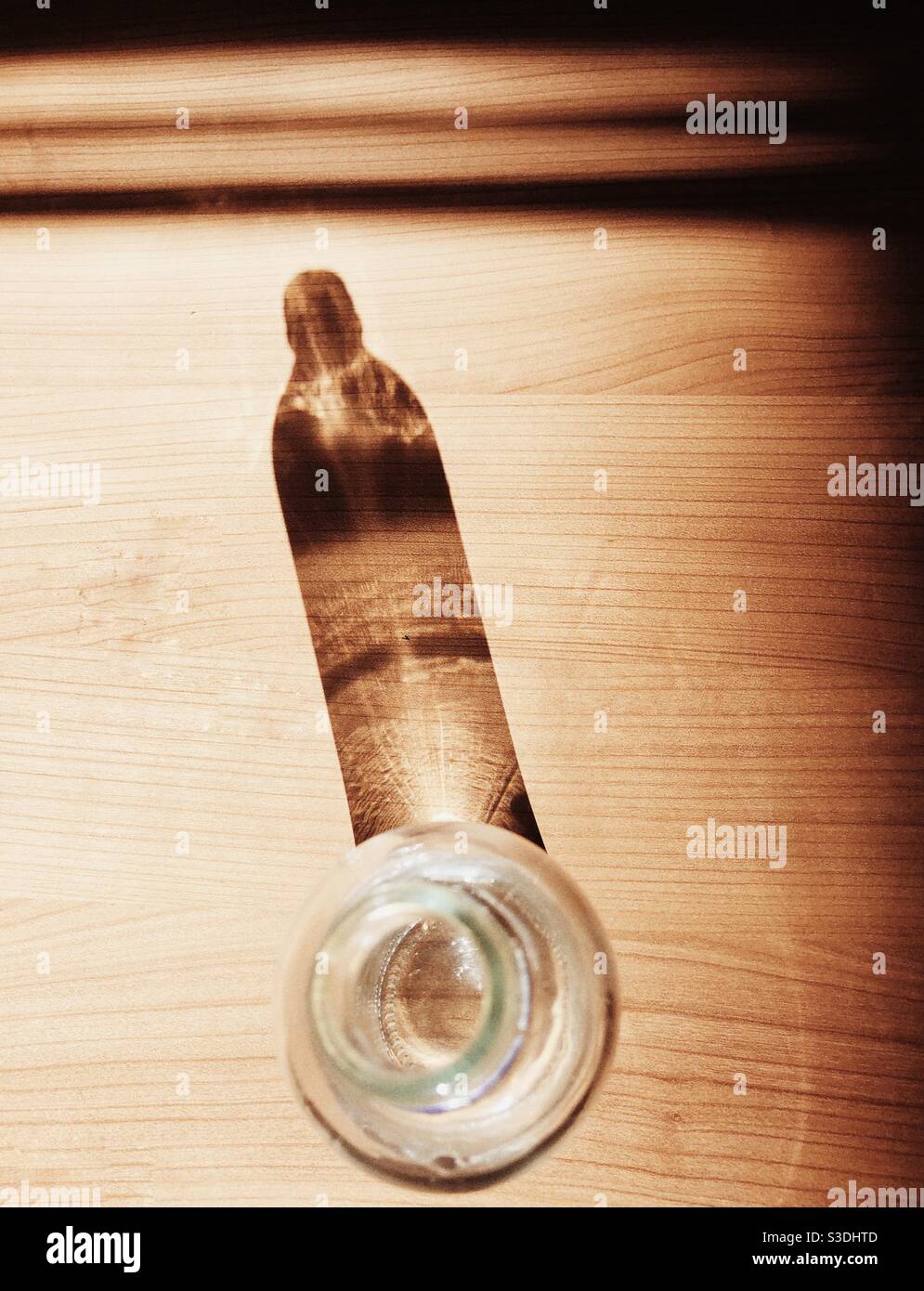 Shadow of a glass bottle Stock Photo - Alamy