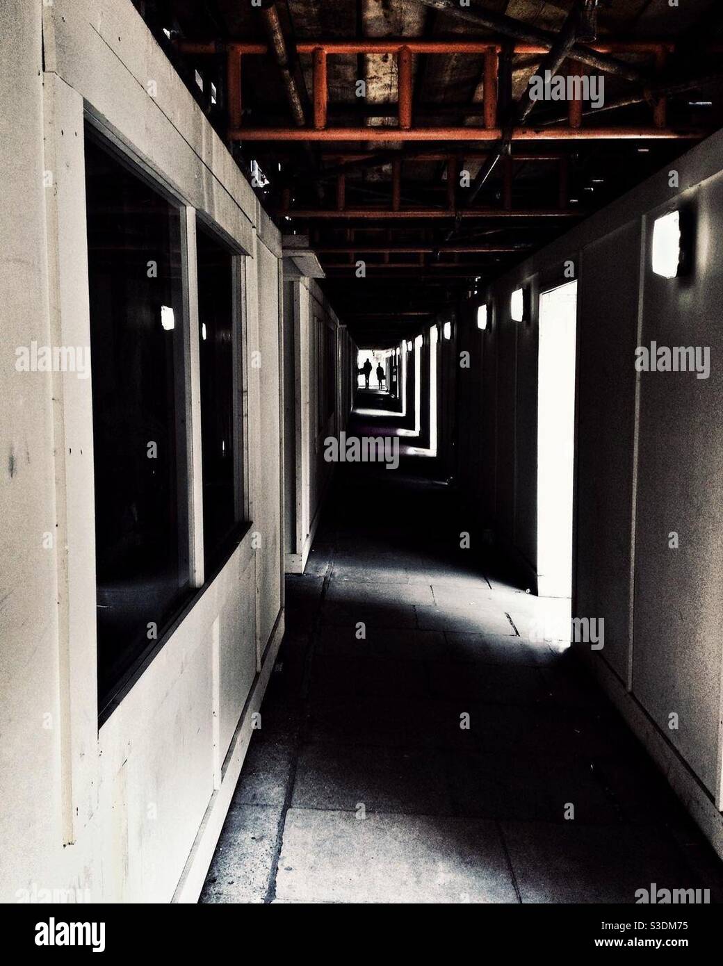 Pedestrian safety walkway attached to a building under construction ...