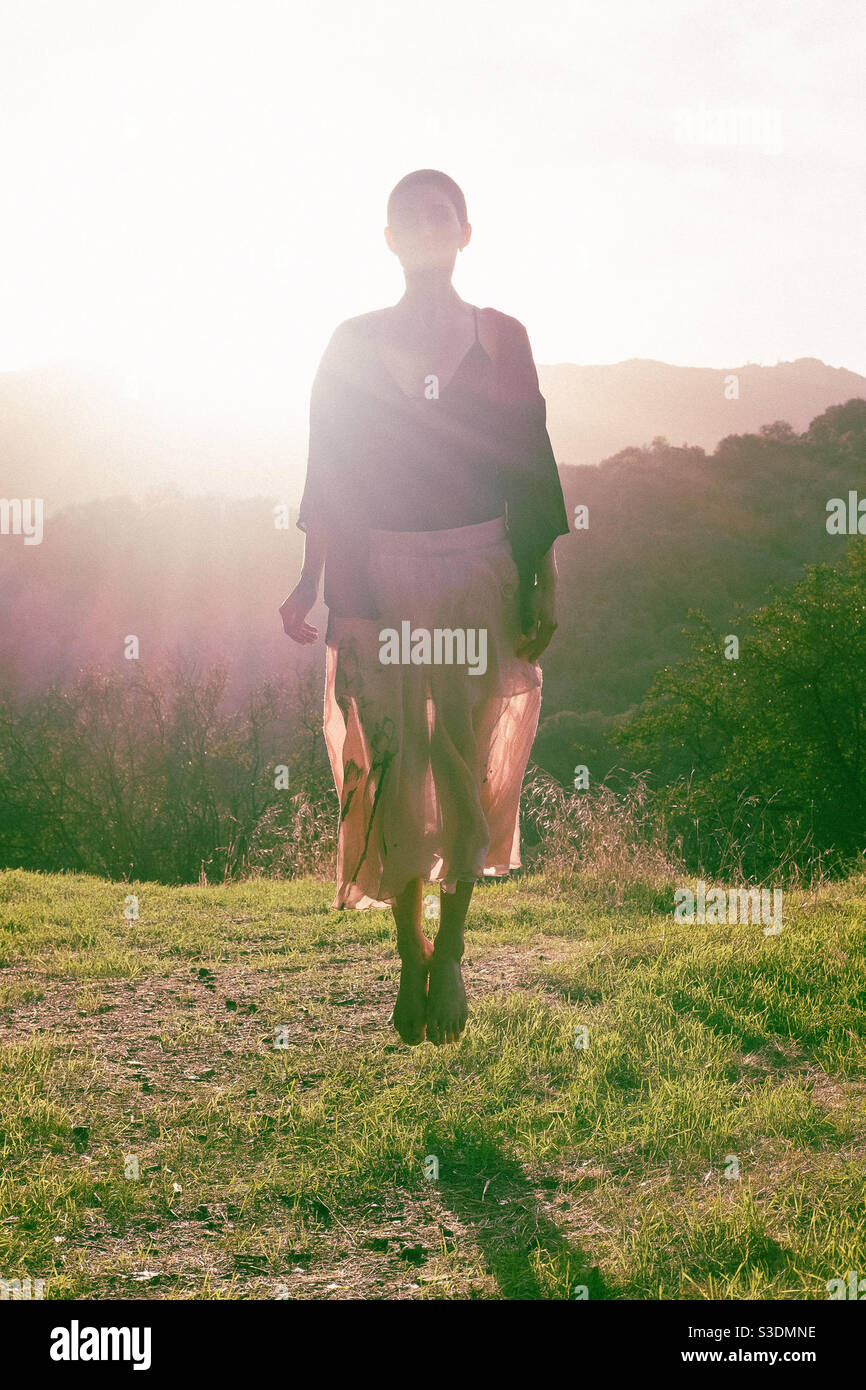 Floating girl - levitation Stock Photo - Alamy