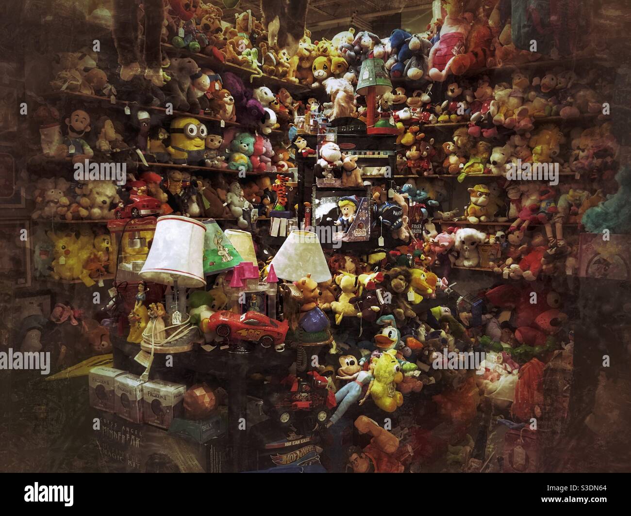Grunge photo of tightly packed toy booth in antique mall Stock Photo ...