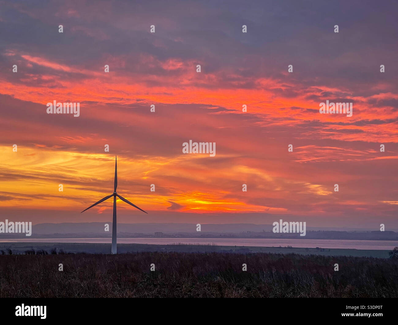 Wind Turbine at Sunrise Stock Photo - Alamy