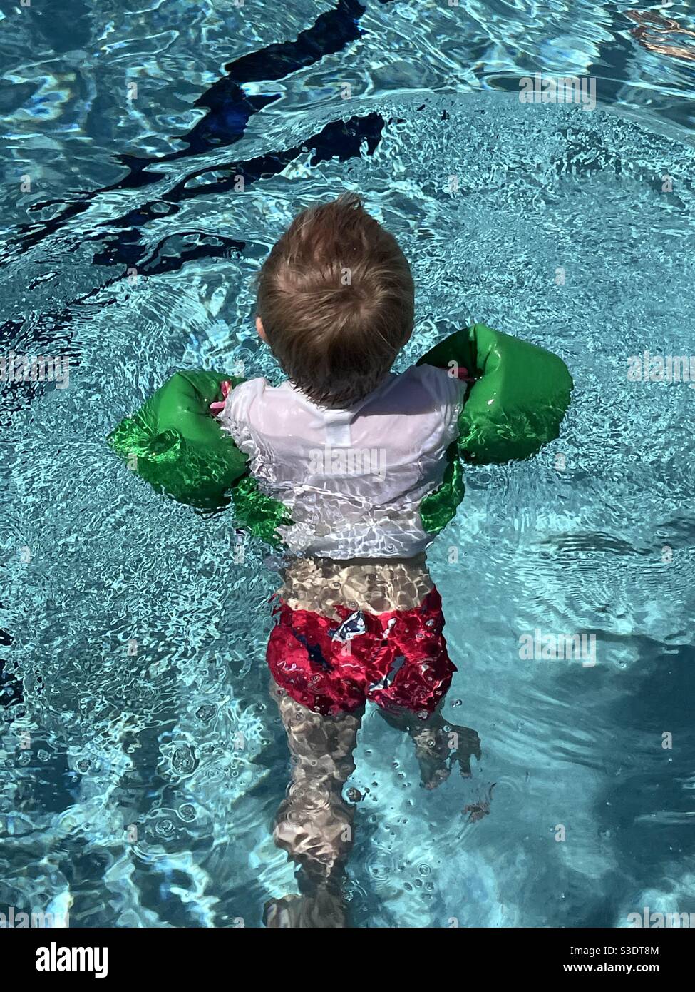 Wearing swim trunks hi-res stock photography and images - Alamy