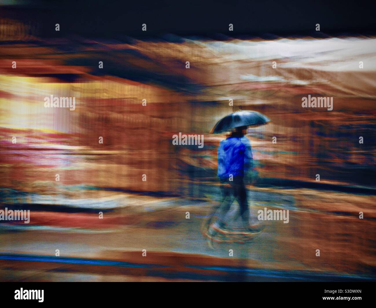 One person with an umbrella hi-res stock photography and images - Alamy