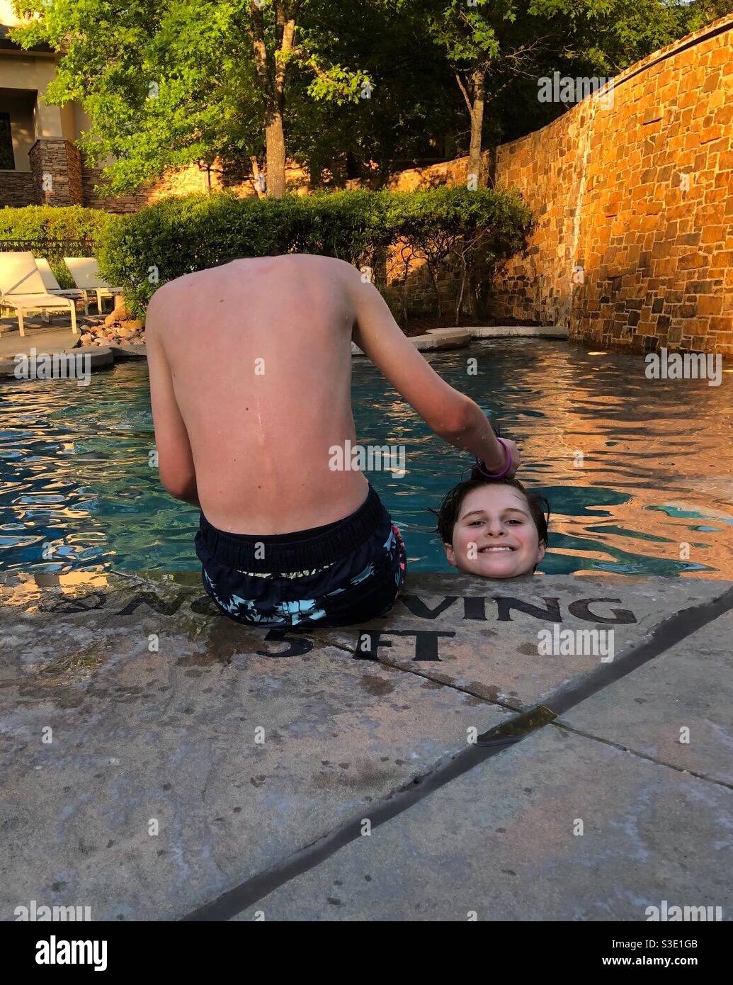 Boys pool hi-res stock photography and images - Alamy