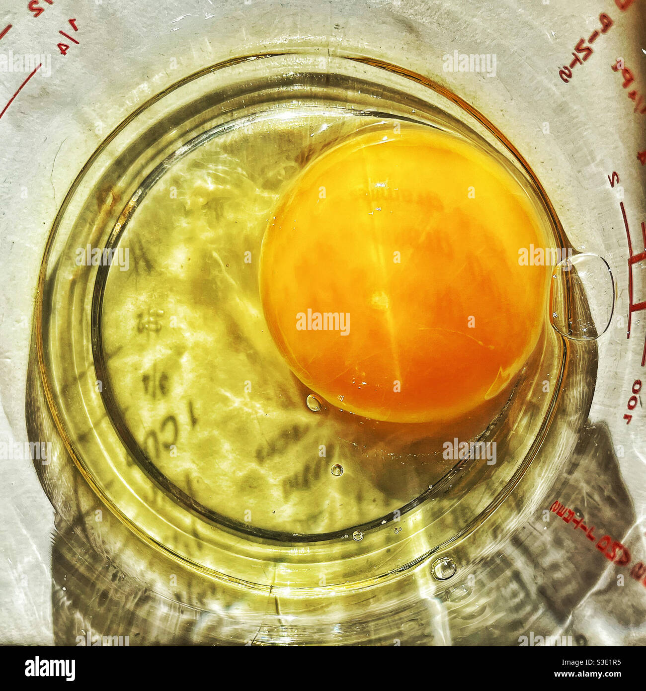 Single egg yolk in a measuring jug Stock Photo - Alamy