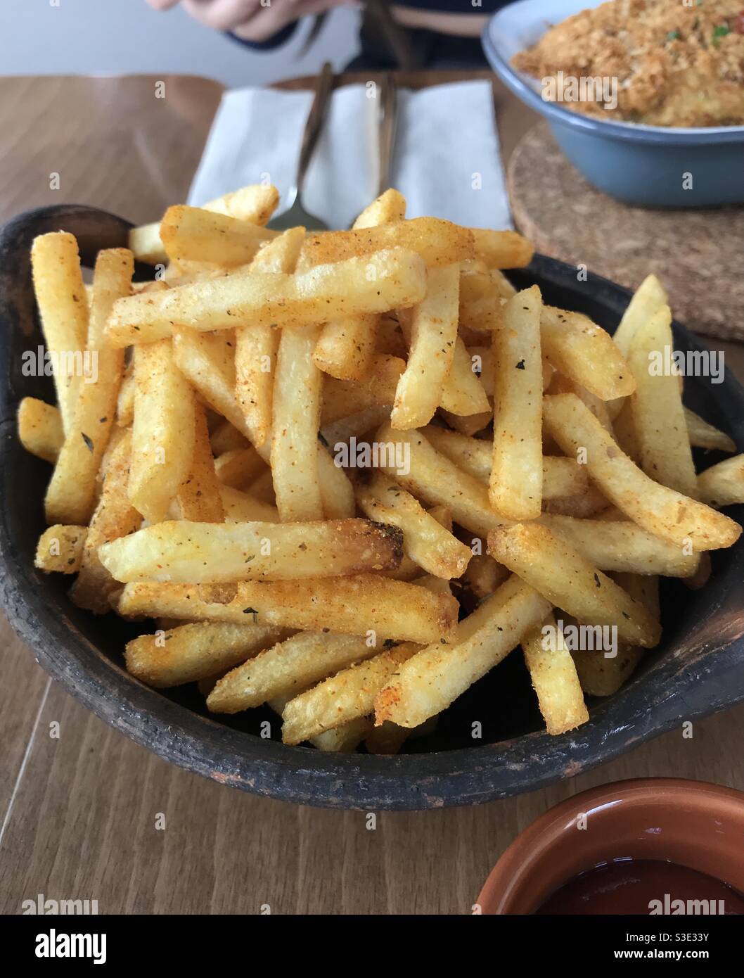 Closeup image of a bowl of French fries Stock Photo - Alamy