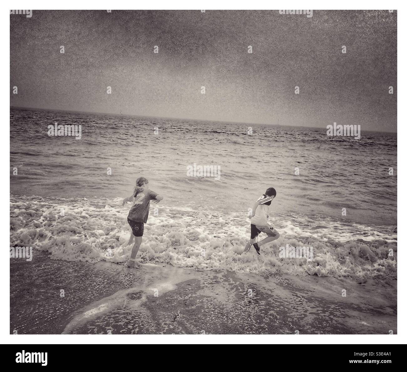 Children playing waves hi-res stock photography and images - Alamy