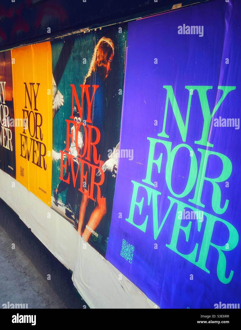 Posters on the side of a building in New York Stock Photo - Alamy