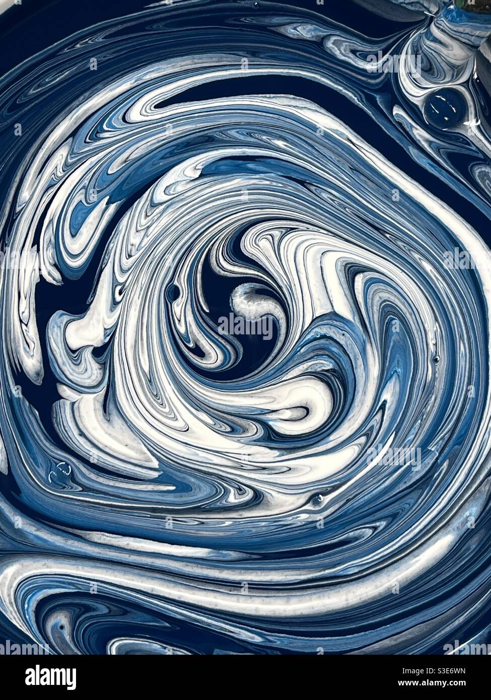 Swirles of blue and white paint Stock Photo - Alamy