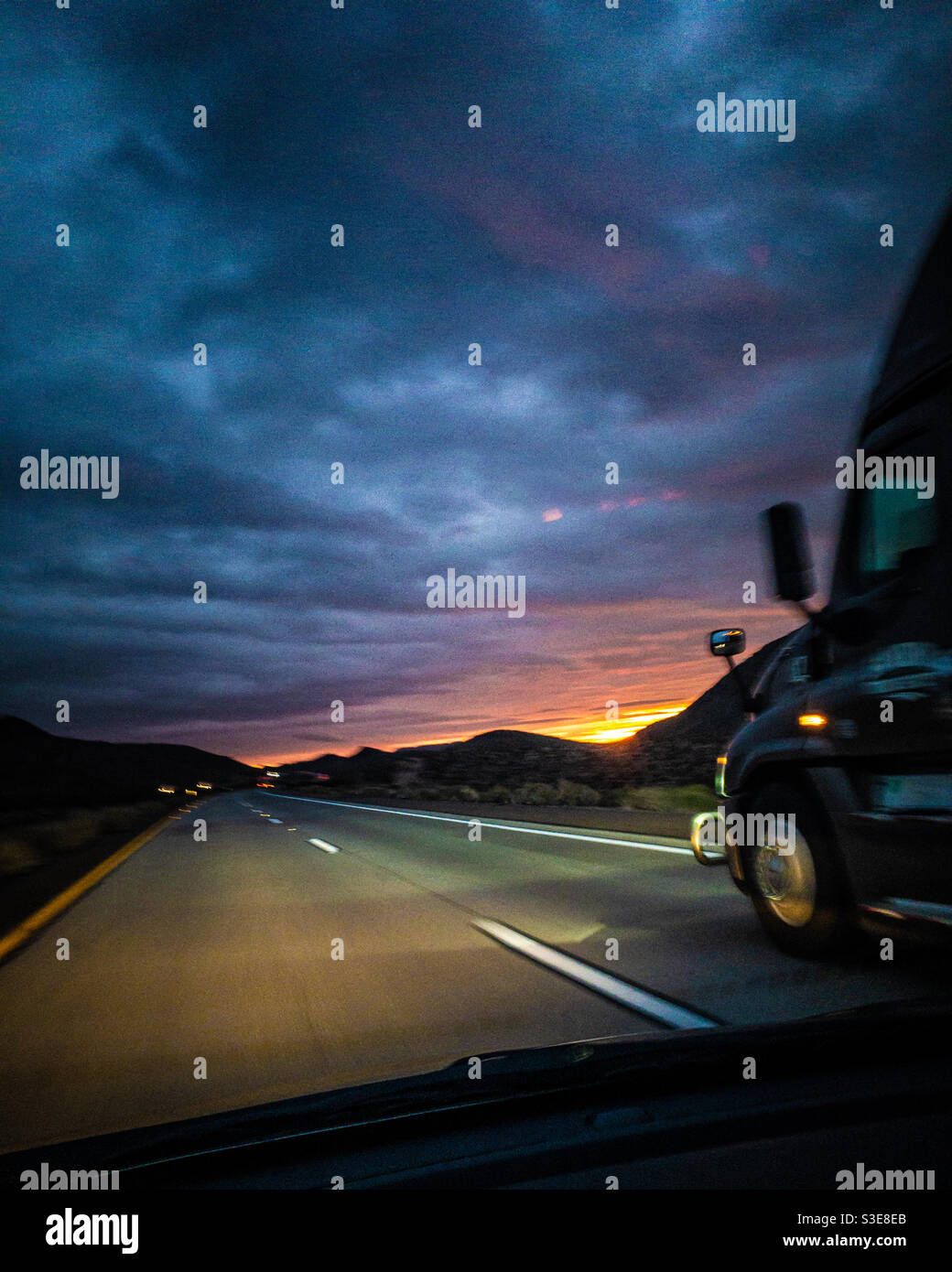 Driving into a beautiful sunset on Route 66 Stock Photo - Alamy