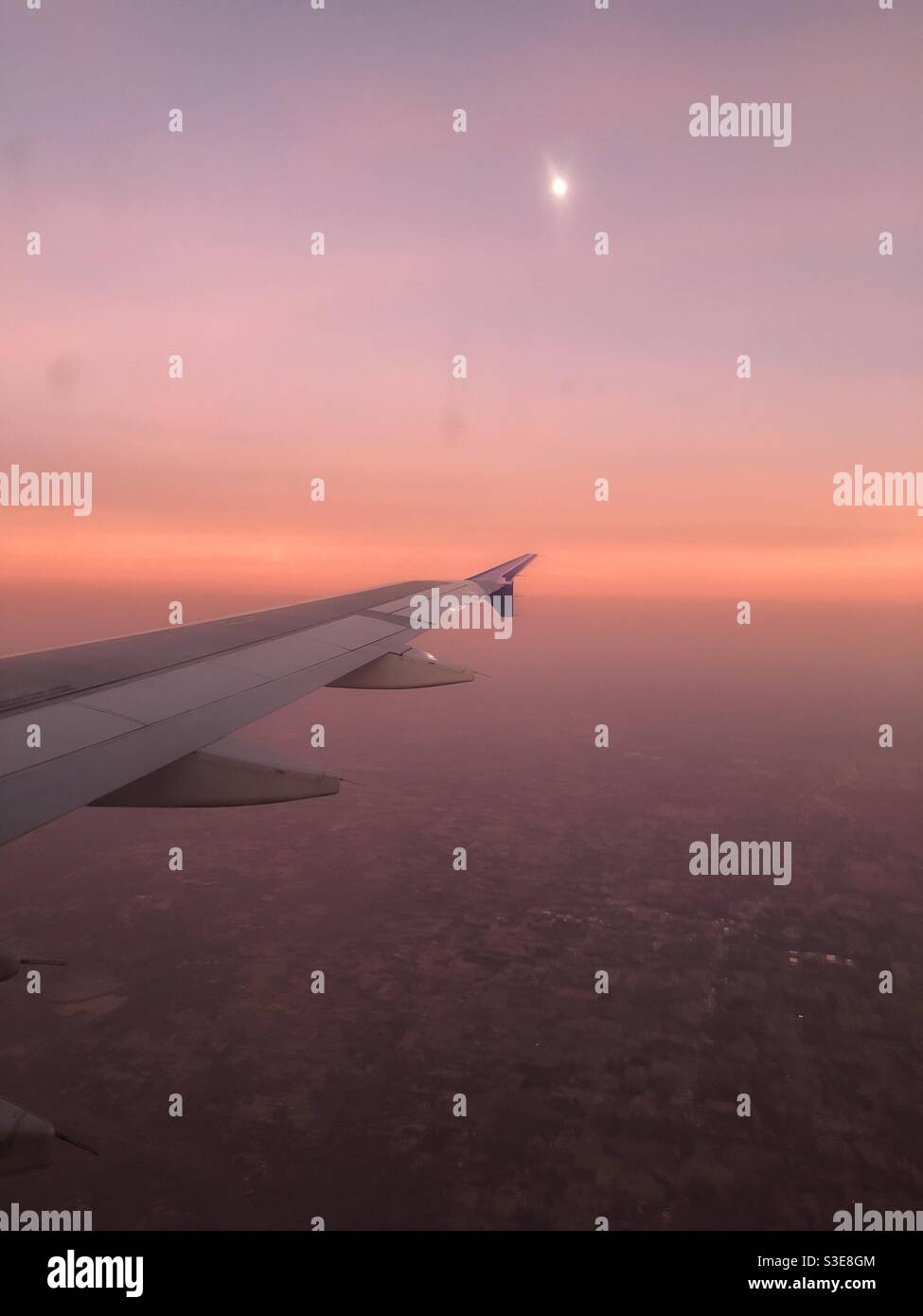 Sunset through a plane window Stock Photo - Alamy