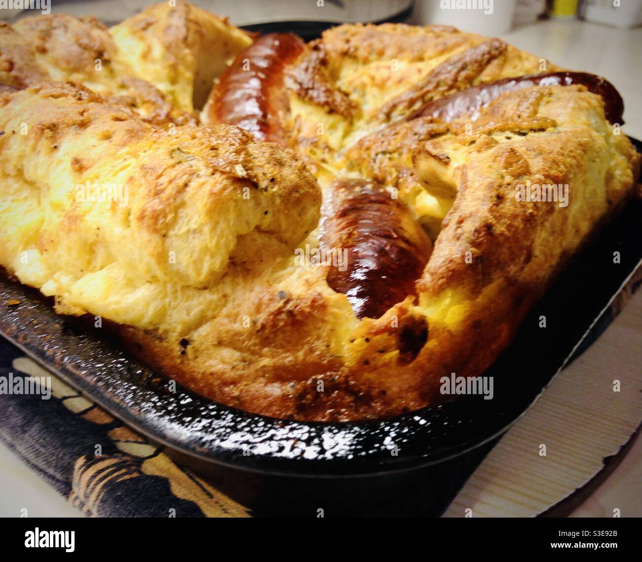 Traditional toad in the hole made with sausages and Yorkshire pudding ...