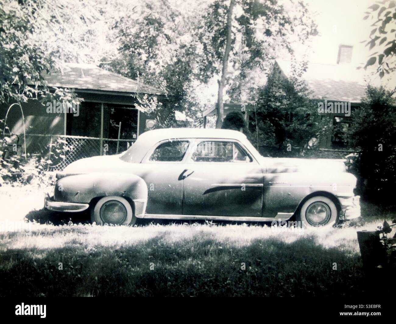 Old car in empty lot Stock Photo - Alamy