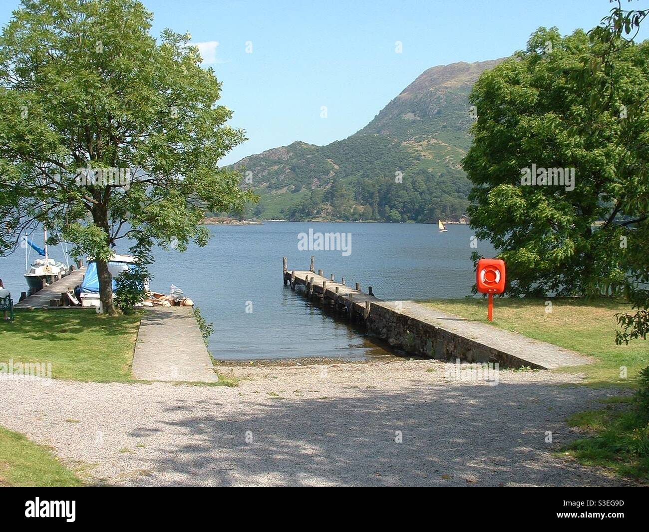 Jetty sticking out into a lake in the Lake District, UK. Wooden jetty ...