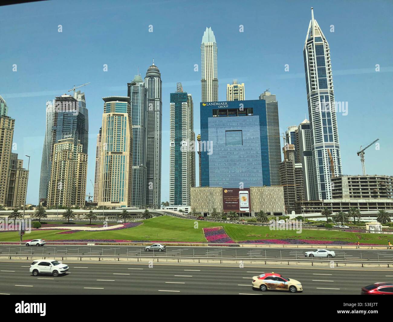 View from Dubai Metro at the modern buildings around Sheikh Zayed Road ...
