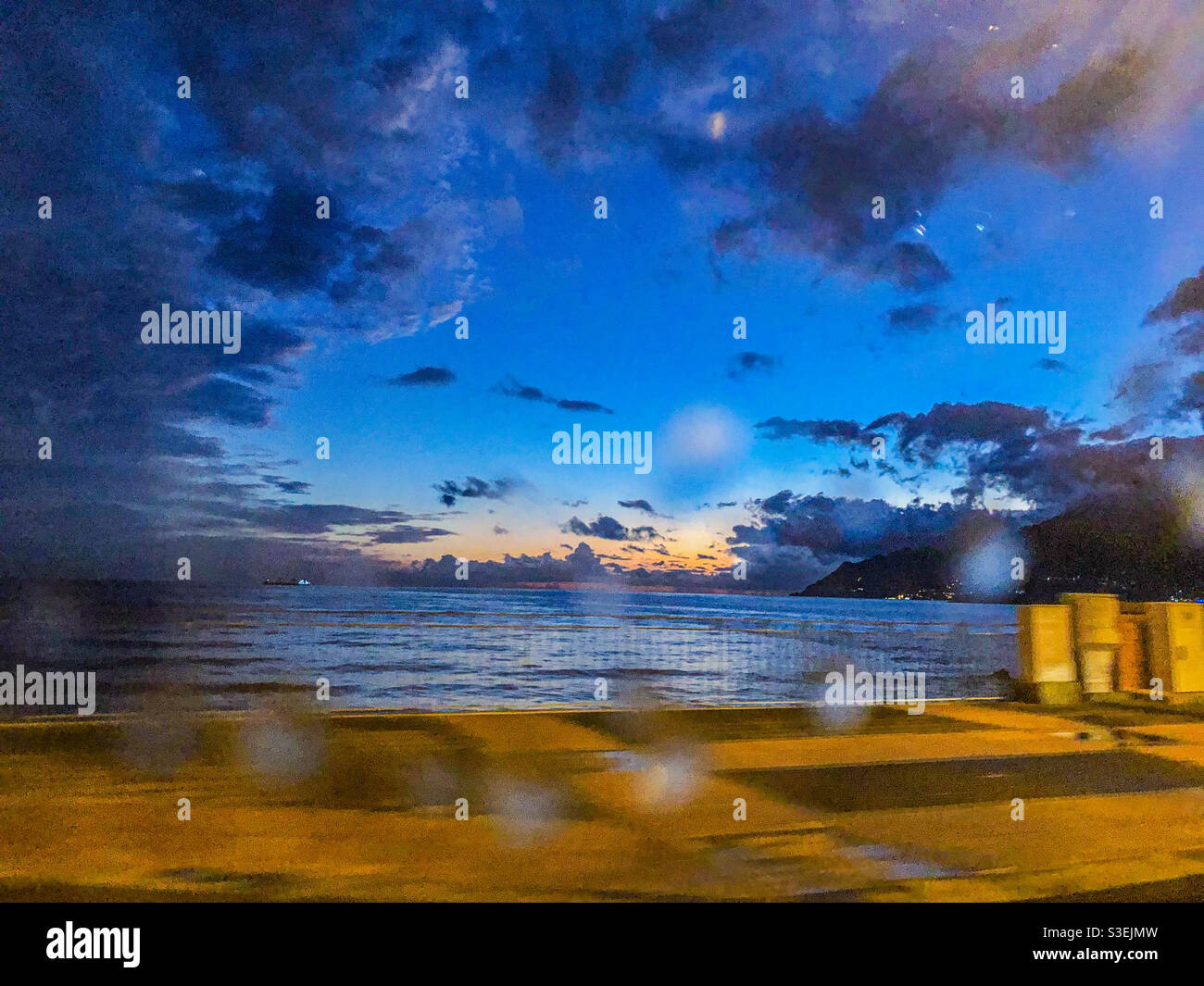 Sunset landscape through a car window Stock Photo - Alamy
