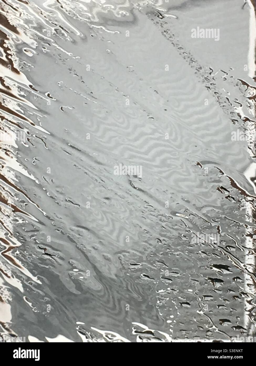 Distorted window as view through a car windscreen in a storm Stock ...