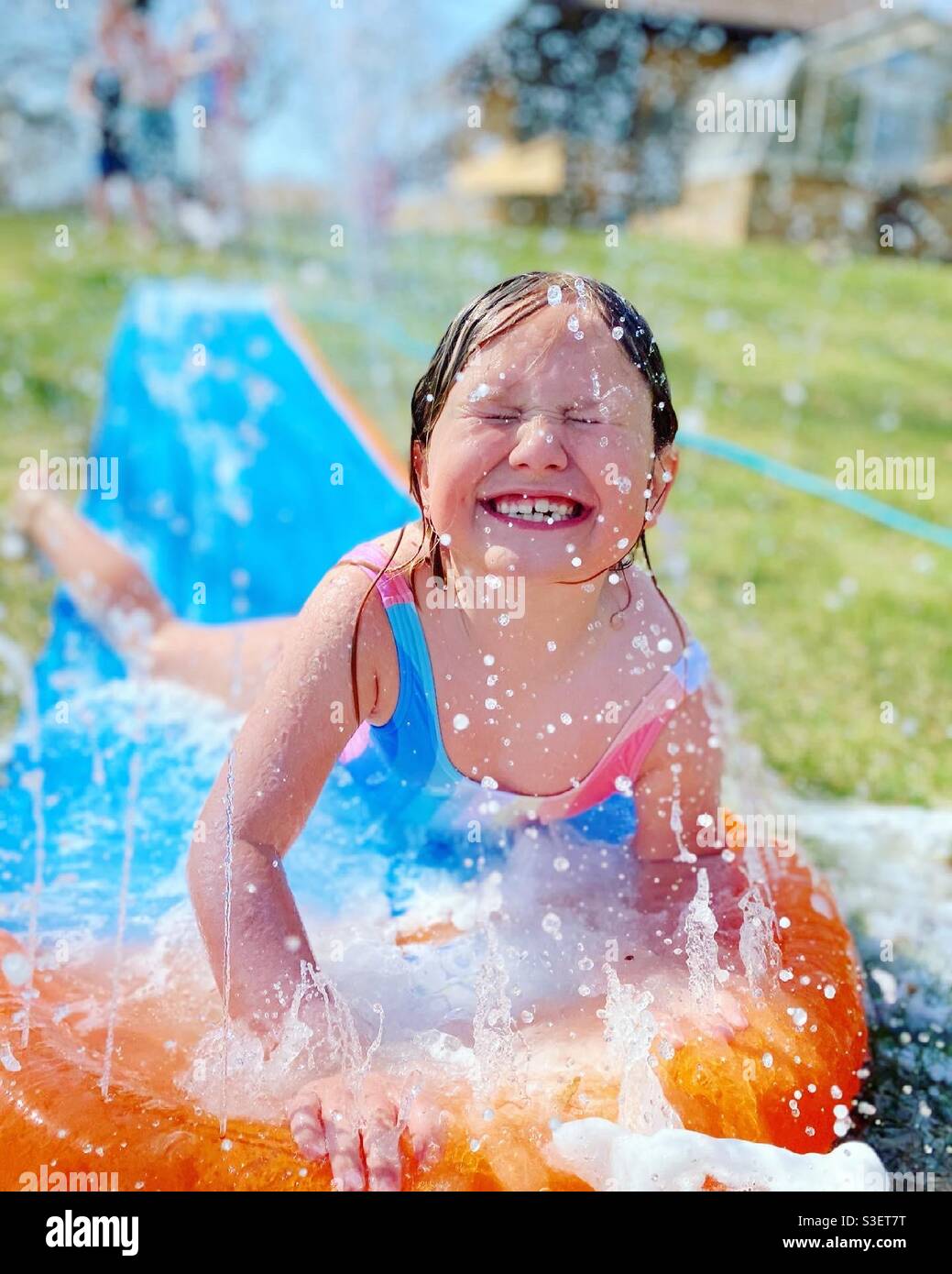 Sliding into summer Stock Photo - Alamy