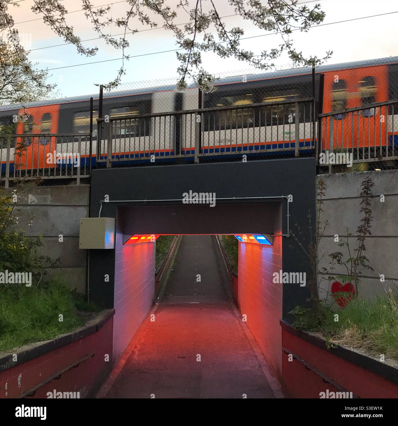 Train over underpass Stock Photo - Alamy