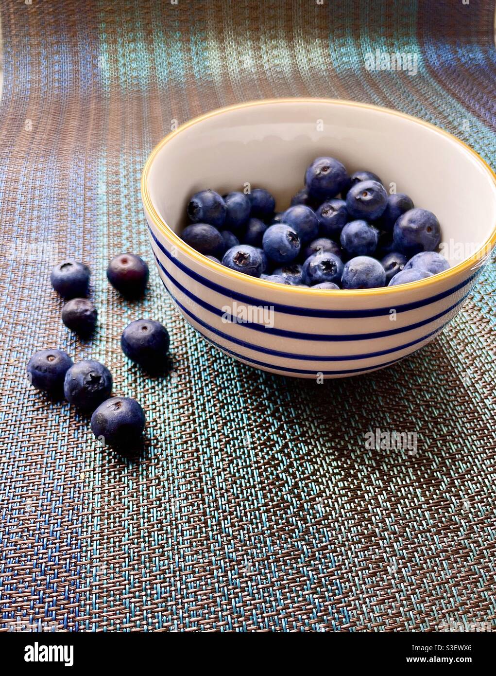 Blue stripe bowl with yellow rim hi-res stock photography and images ...