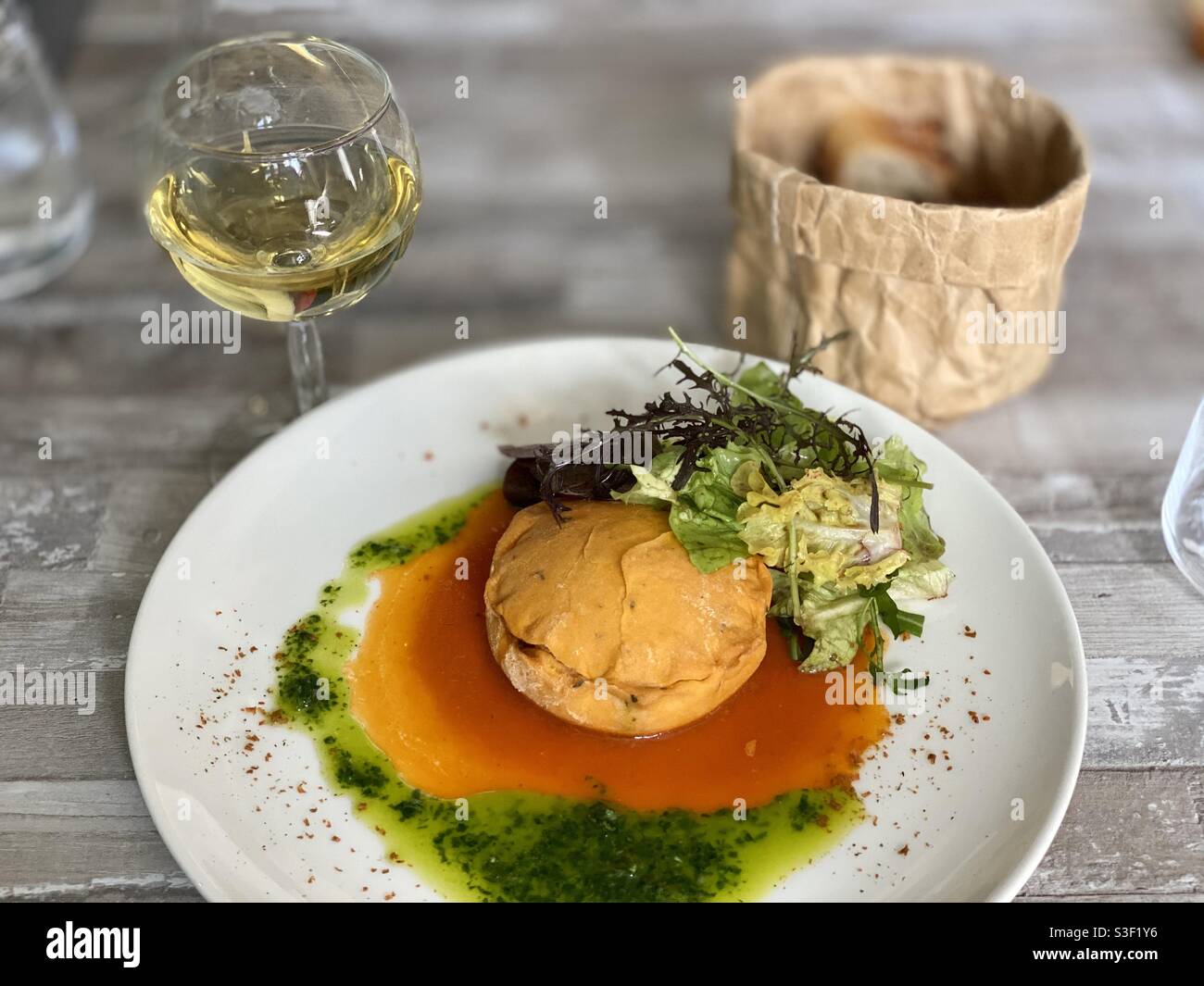 Beef meat bread bun restaurant dish plate with pesto sauce, white wine ...