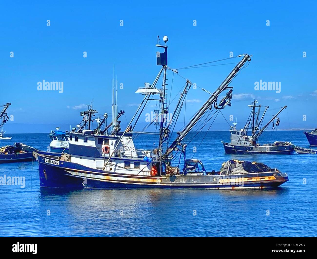 Commercial fishing boat anchored in the harbor Stock Photo - Alamy