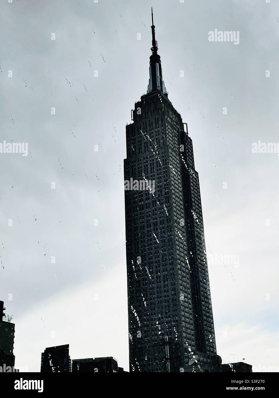 Empire state building through window hi-res stock photography and ...