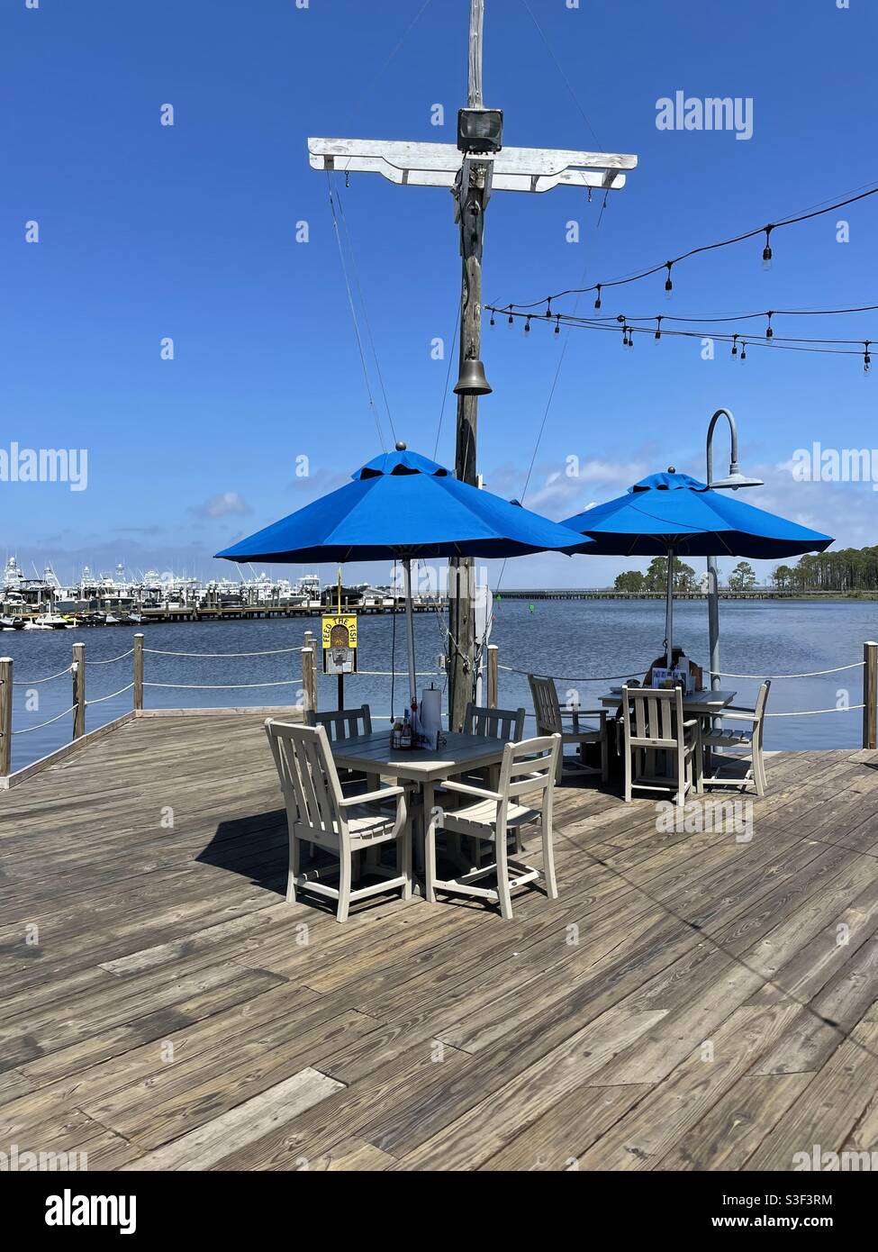 Outdoor dining area at a boat marina Stock Photo - Alamy