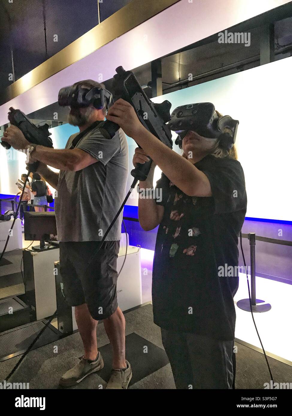 A father and son playing a Virtual Reality game in Tokyo, Japan Stock ...