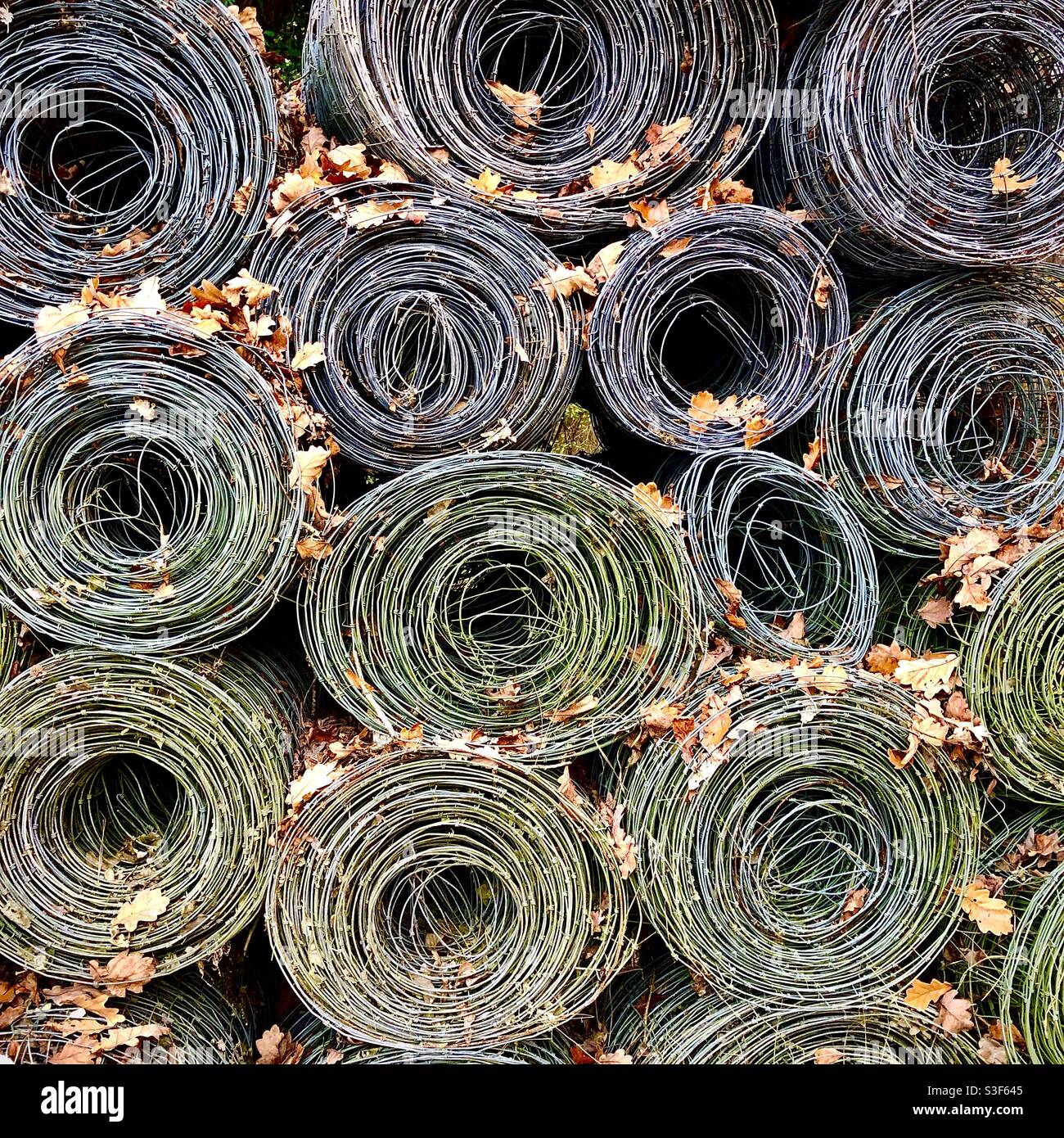 Large stack of rolls of wire netting Stock Photo - Alamy