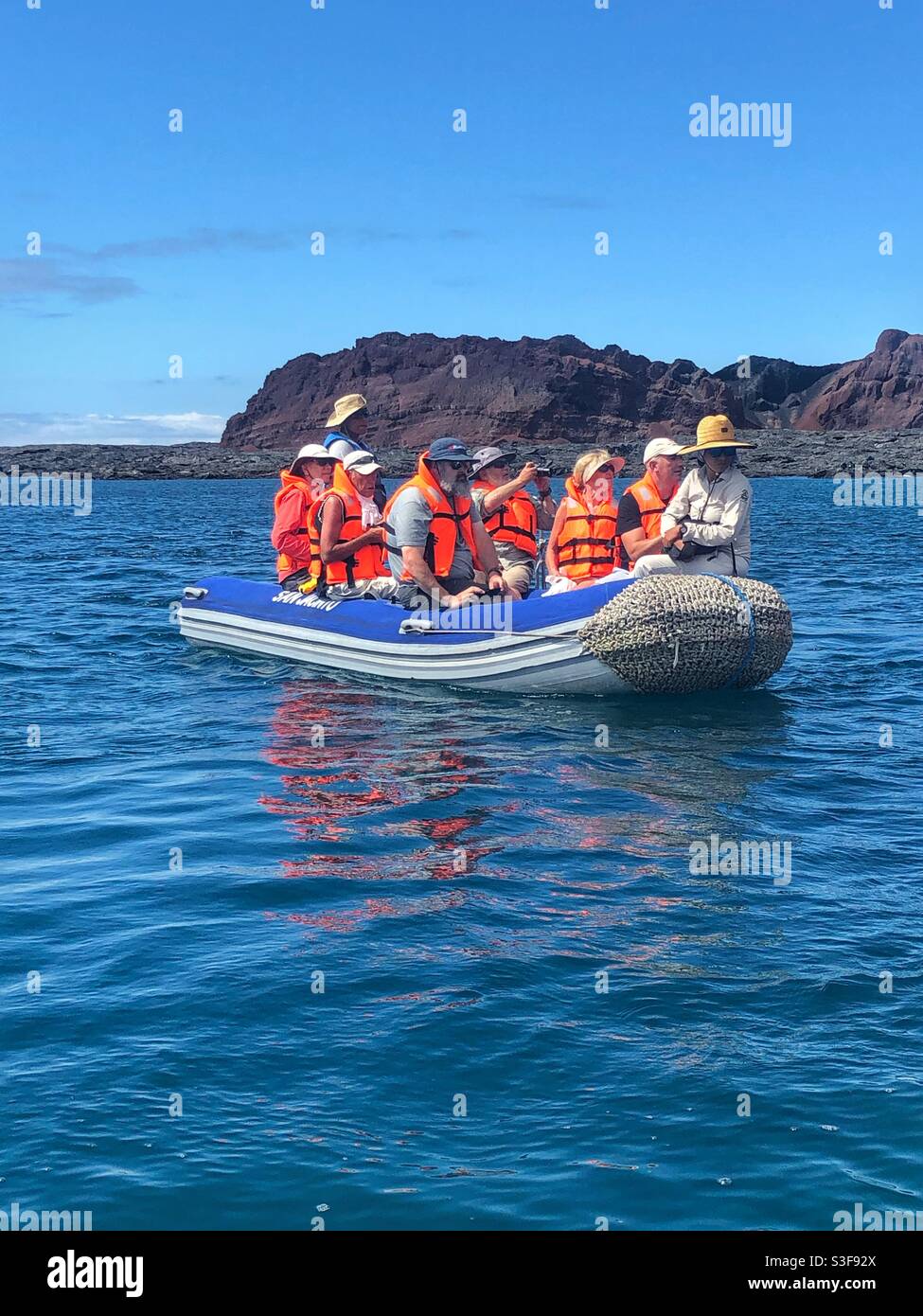 A group of tourists on an inflatable raft in the Galápagos Islands ...