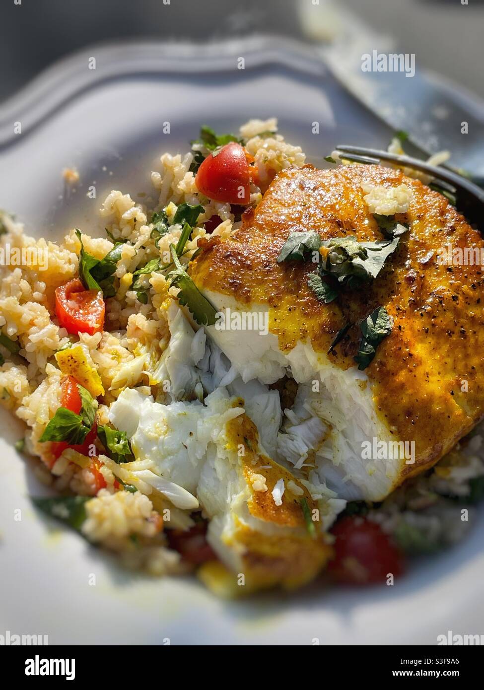 Cod baked with turmeric and cornflour coating, on cauliflower rice ...