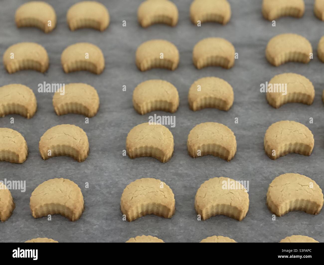 Many moon design fresh baked biscuits Stock Photo - Alamy