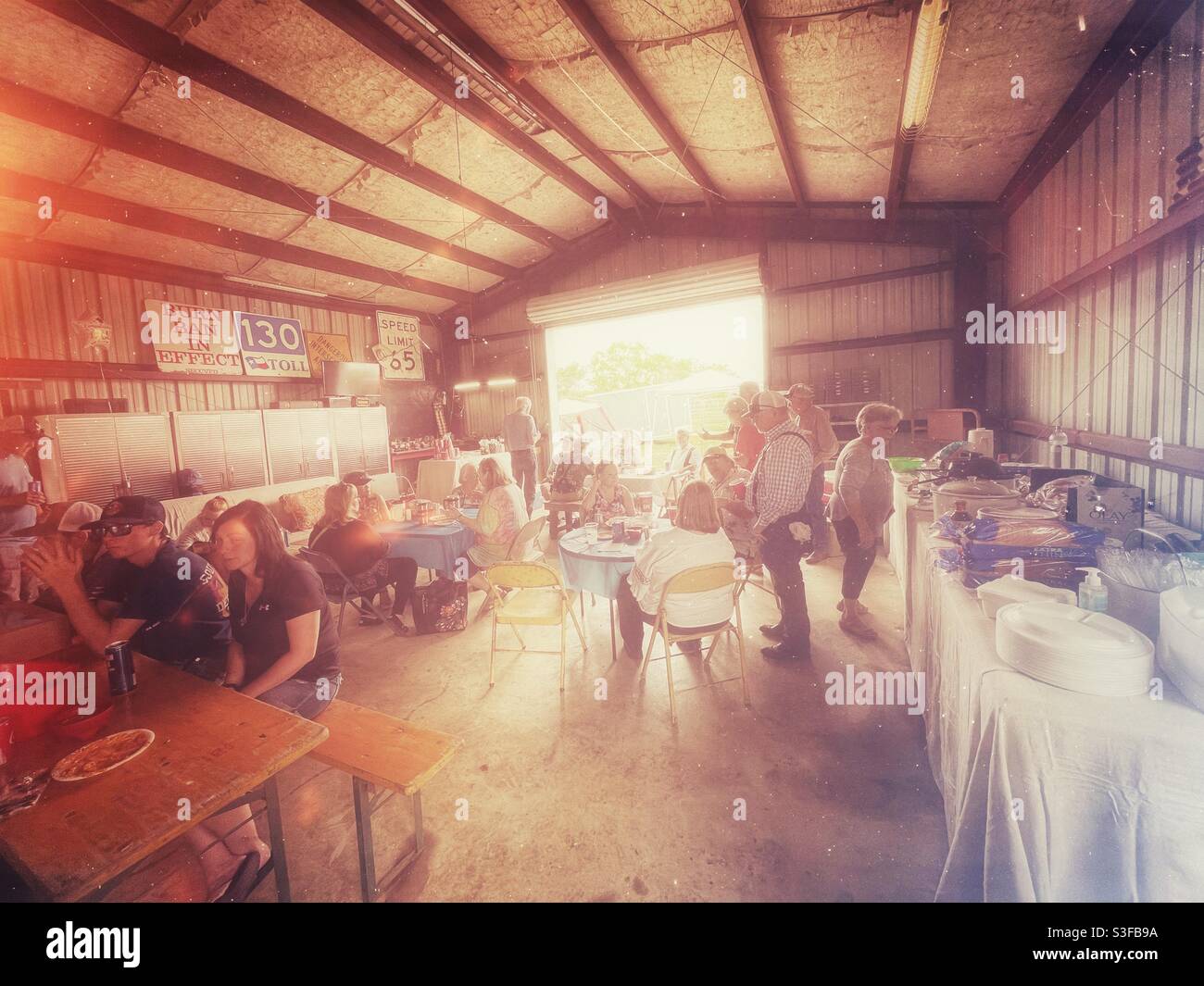 Crowd of people sitting at tables at a reunion or party Stock Photo - Alamy