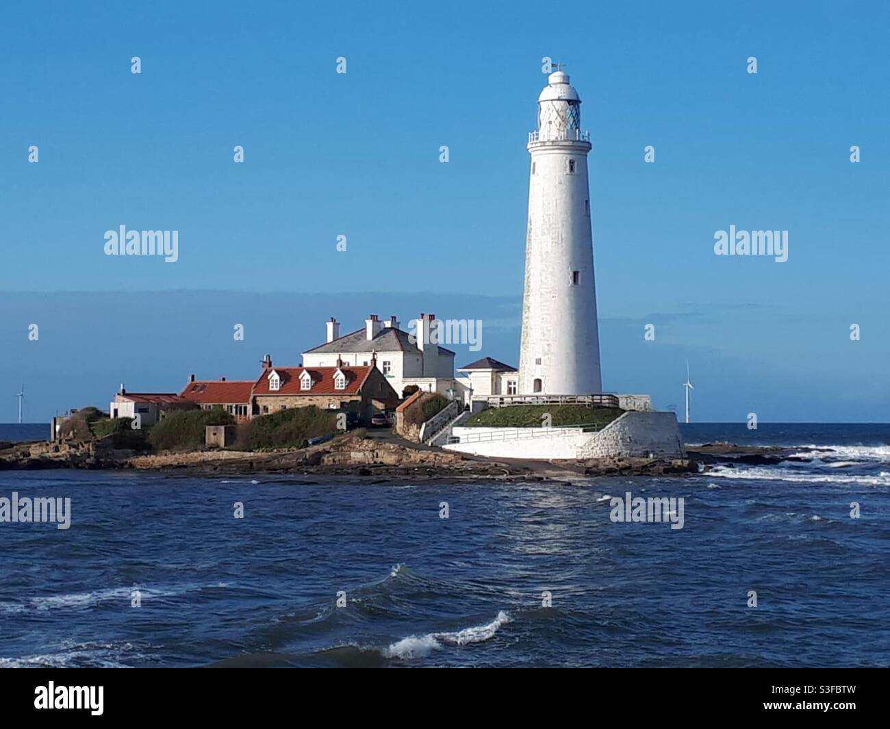 Lighthouse surrounded by water Stock Photo - Alamy