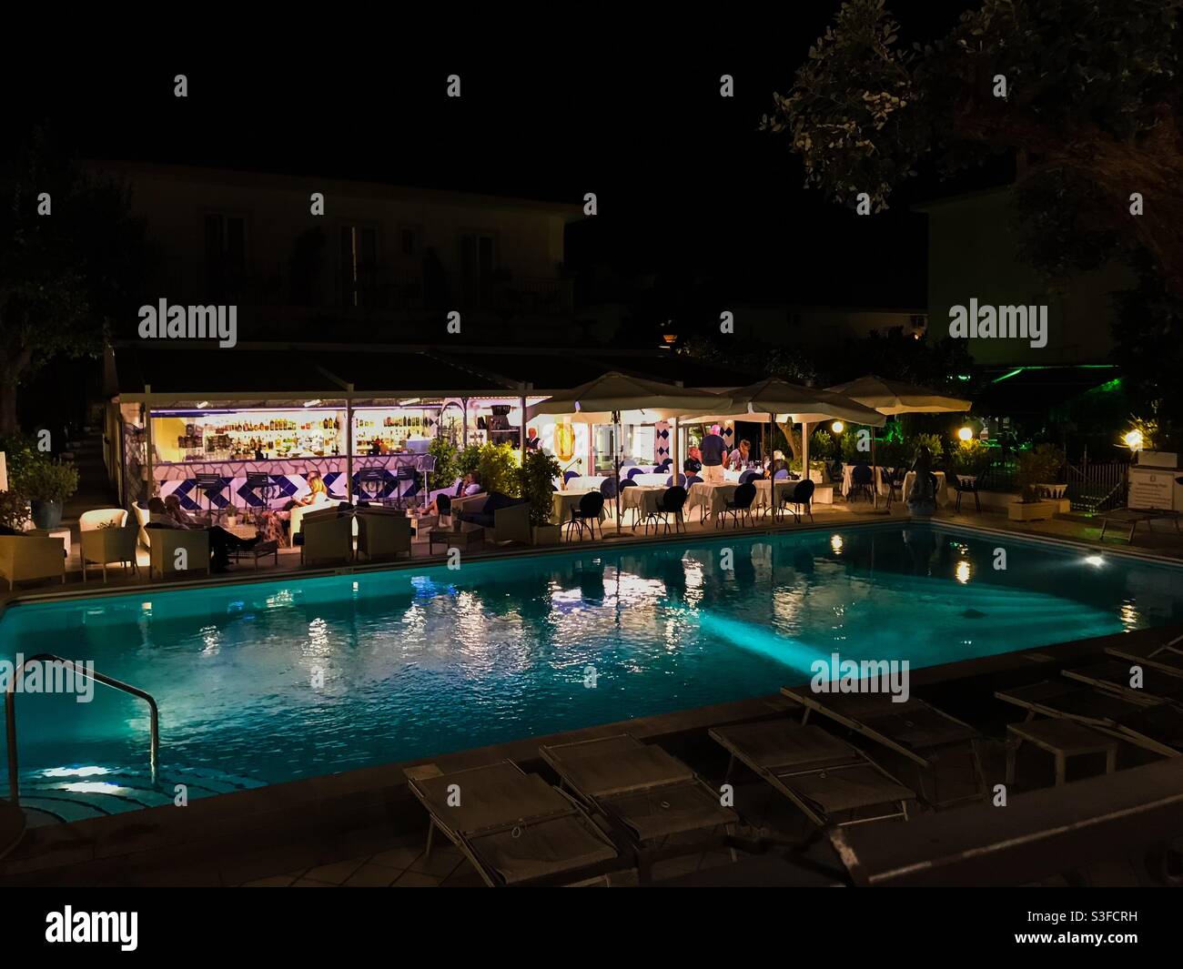Summer nights by the pool Stock Photo - Alamy
