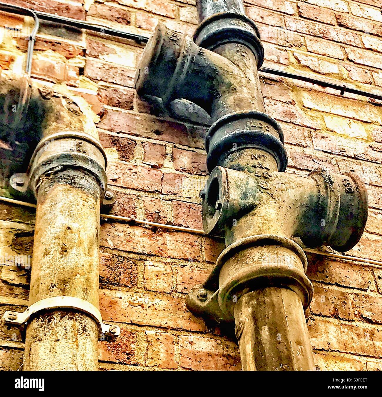 Rusted drainage pipes on a London building Stock Photo - Alamy