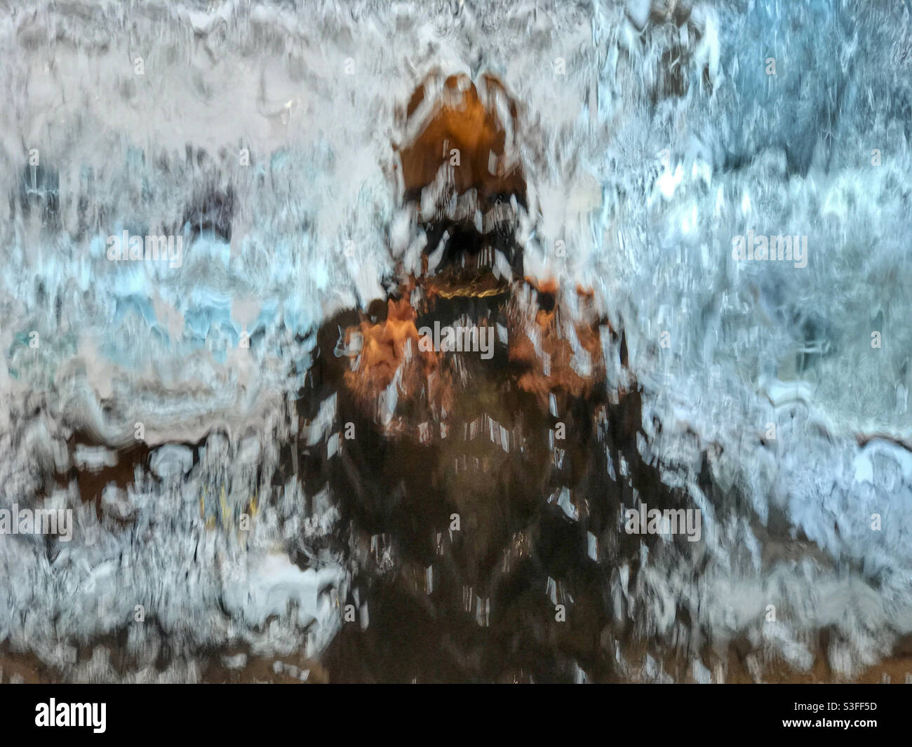 Blurred reflection in a wall of water Stock Photo - Alamy