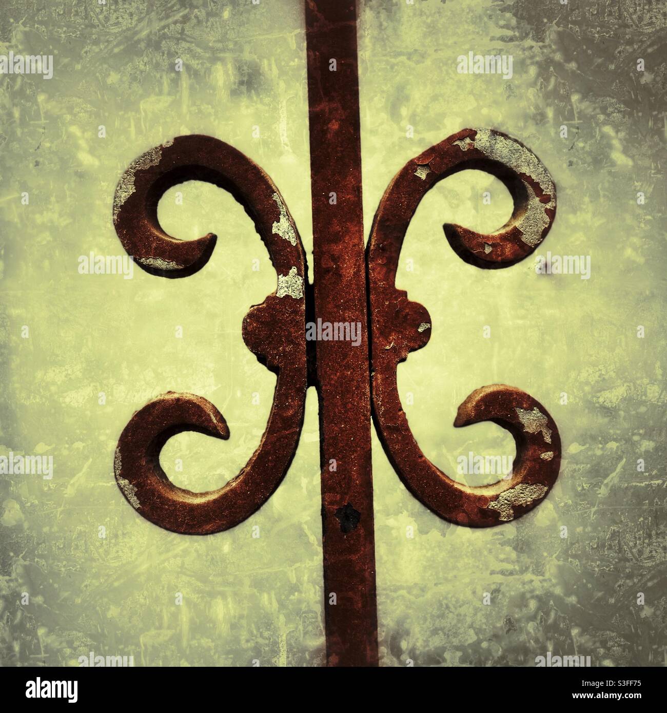 Wrought iron post with decorative curly iron Stock Photo - Alamy