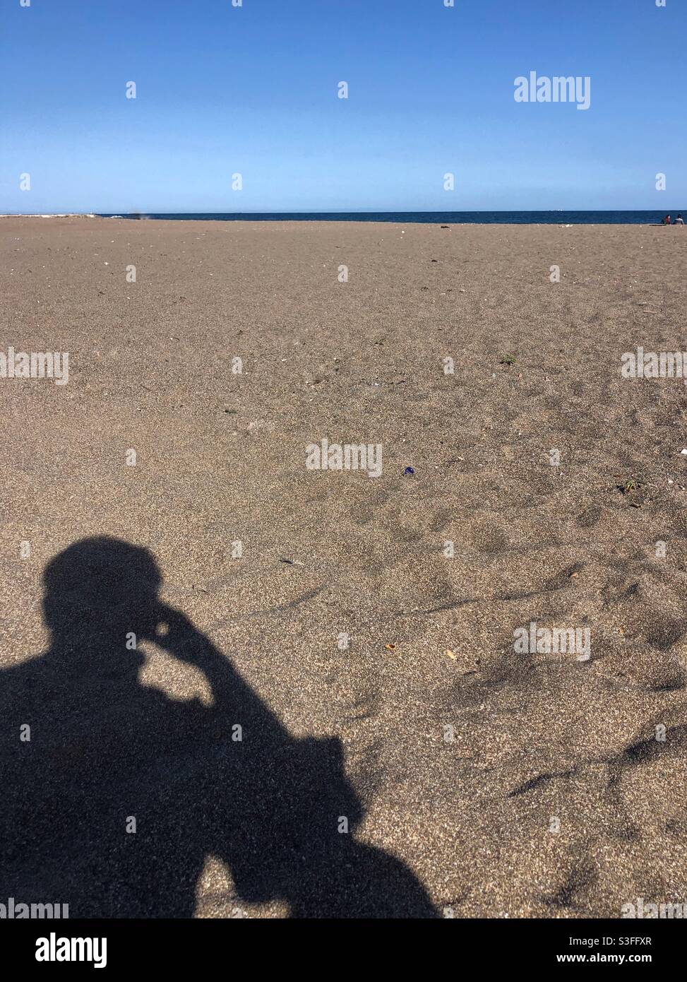 Shadow of a Man thinking on beach Stock Photo - Alamy