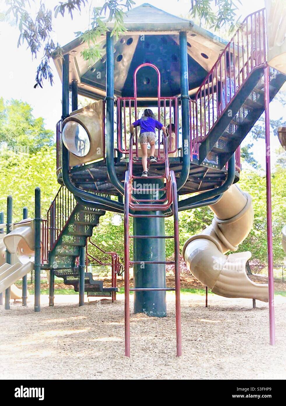 Going places-young girl climbing the ladder at the playground Stock ...