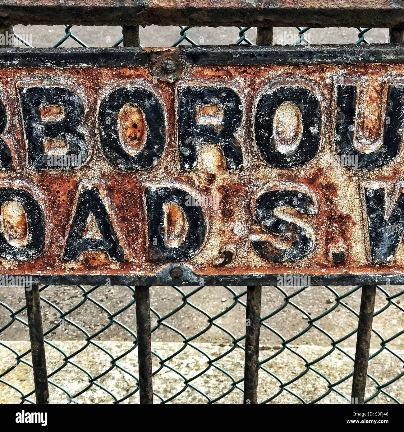Detail of a rusted London street name sign Stock Photo - Alamy