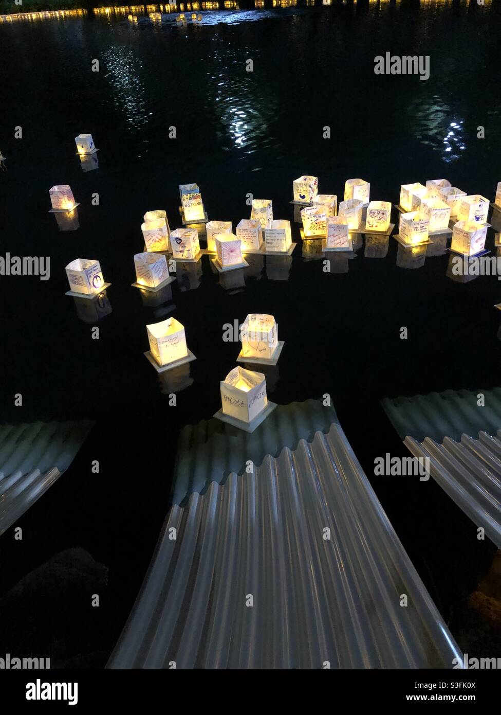 Lanterns floating on the river Stock Photo - Alamy