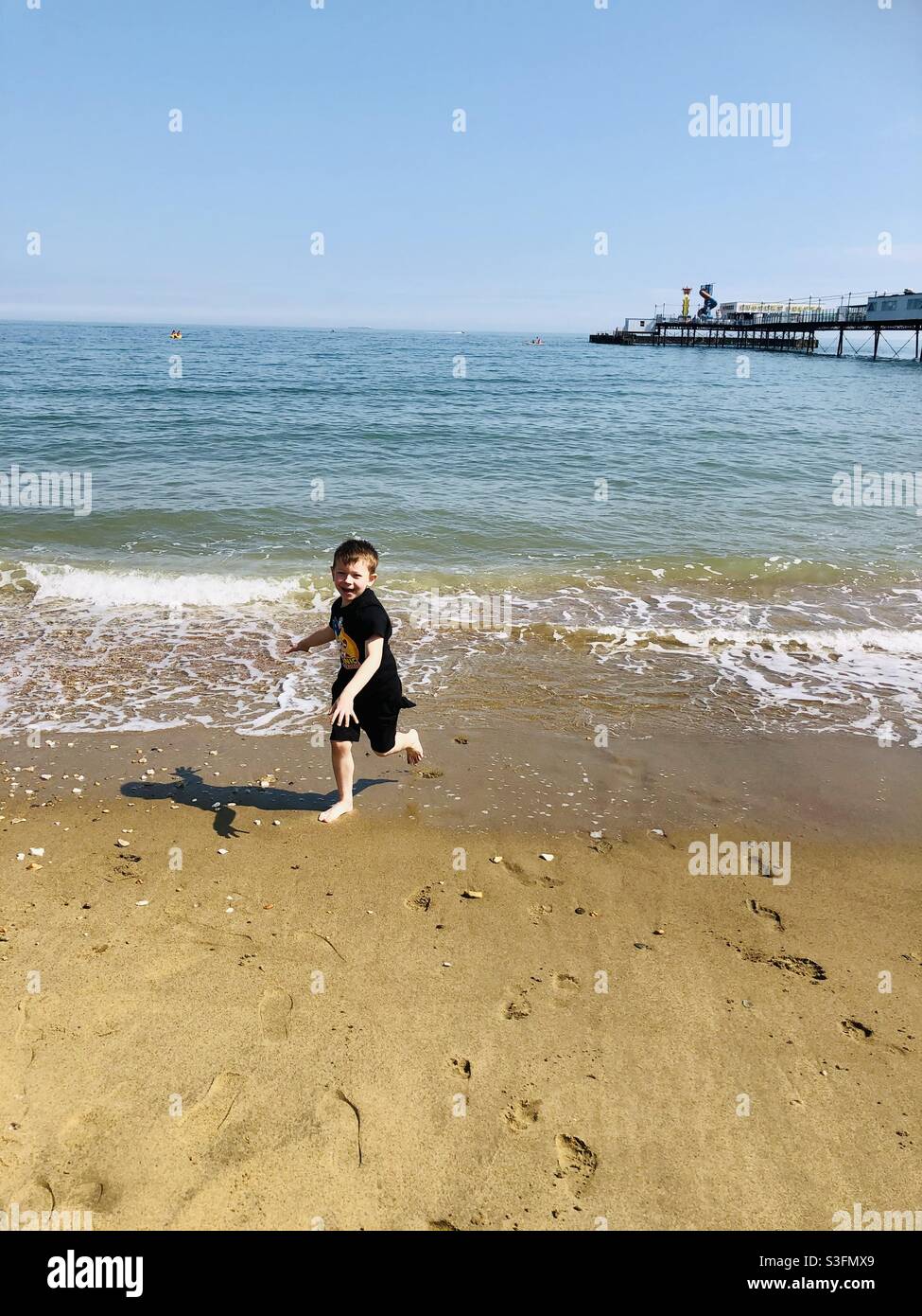 Boy on pier hi-res stock photography and images - Alamy