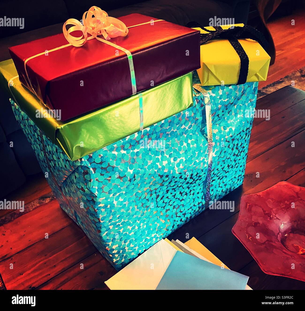 Brightly colored gift boxes on a coffee table in suburbia, USA Stock ...
